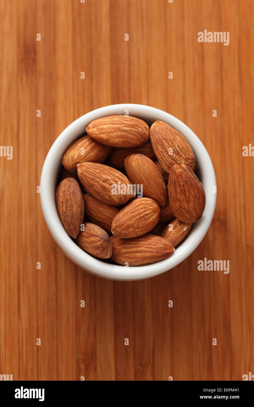 Almonds in a bowl. Close-up Stock Photo - Alamy