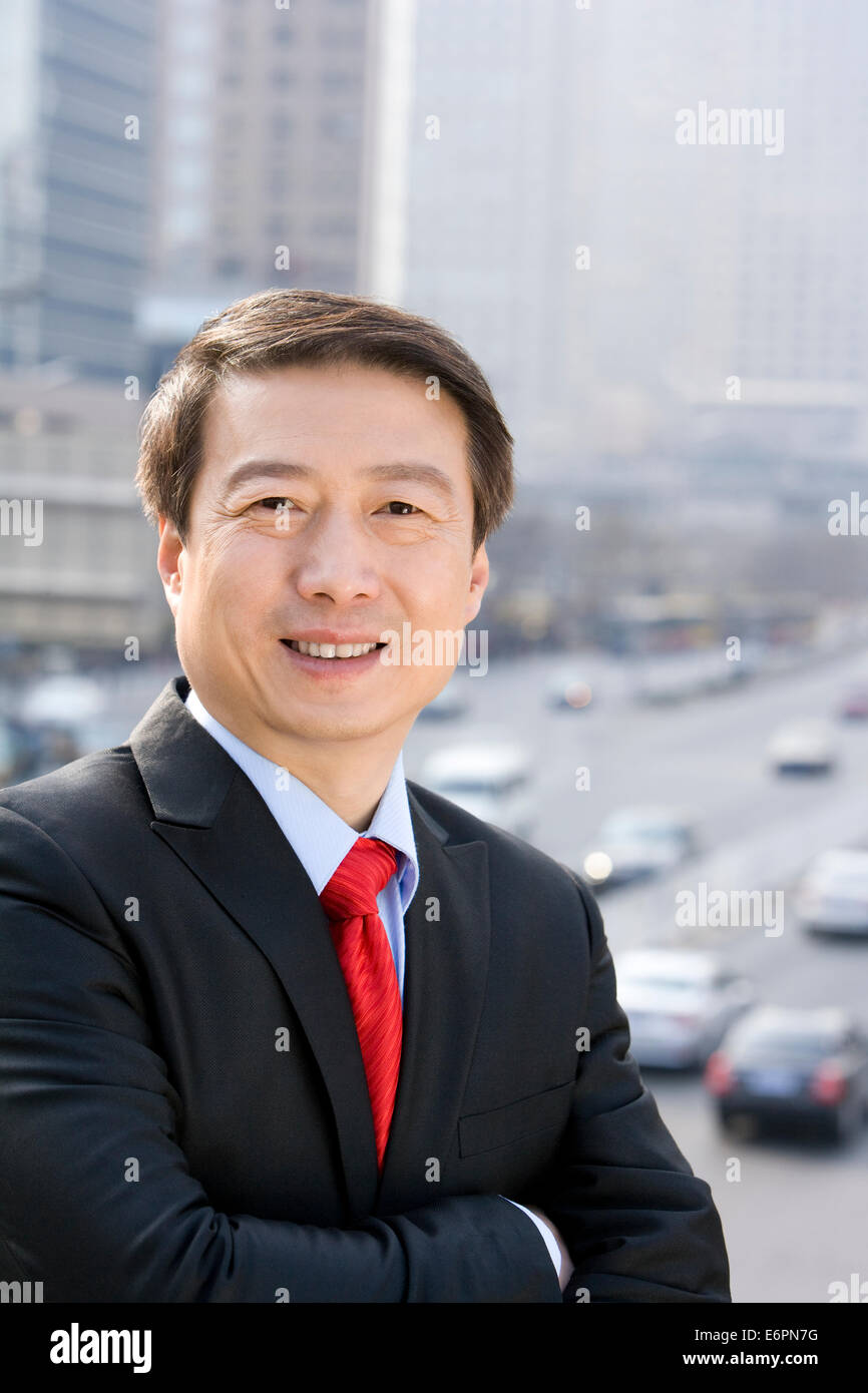 Mature businessman standing over hi-res stock photography and images ...