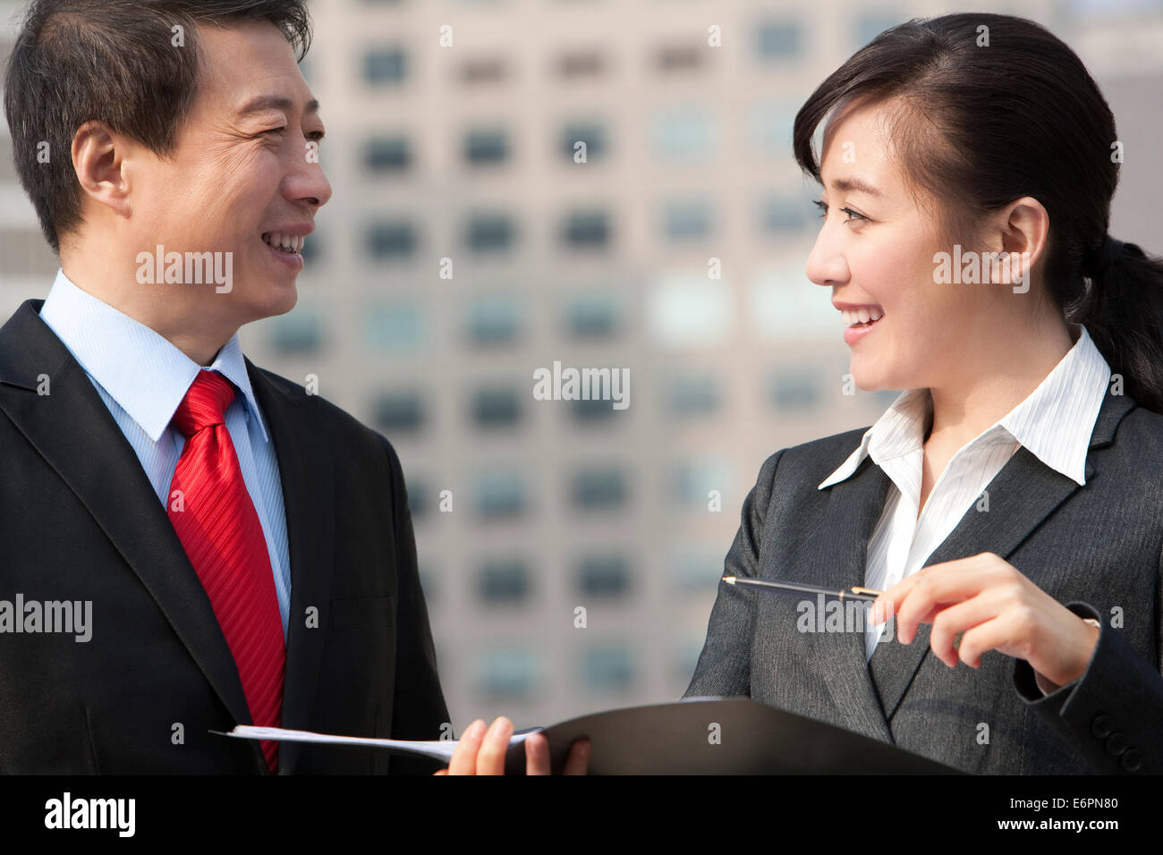 Mature businessman explaining contract colleagues hi-res stock ...