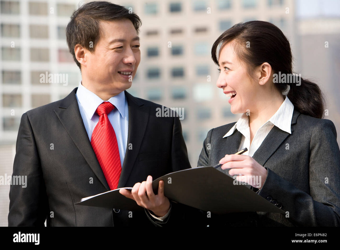 Mature businessman explaining contract colleagues hi-res stock ...