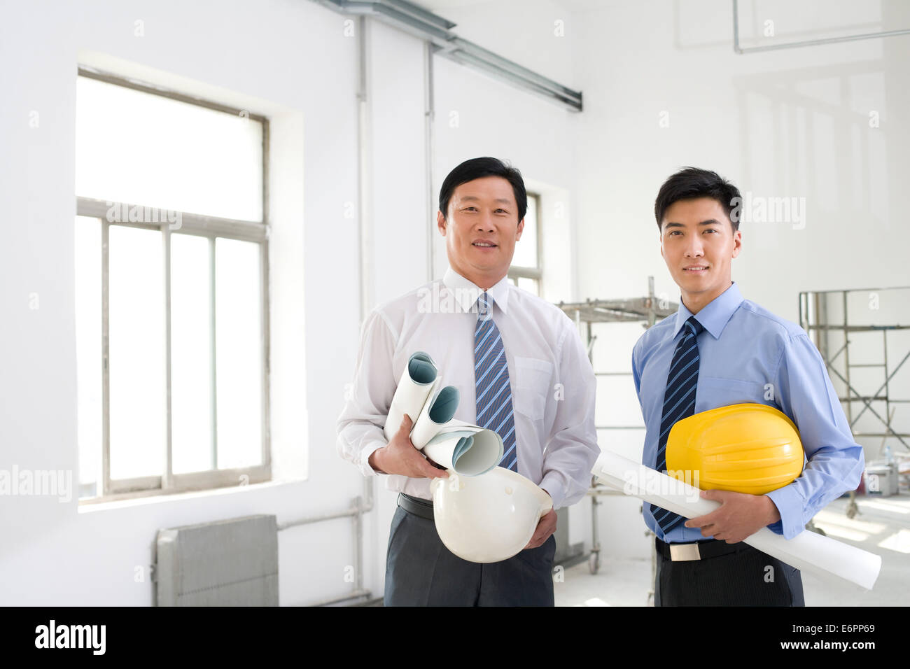 Portrait of two confident men at a construction site Stock Photo - Alamy