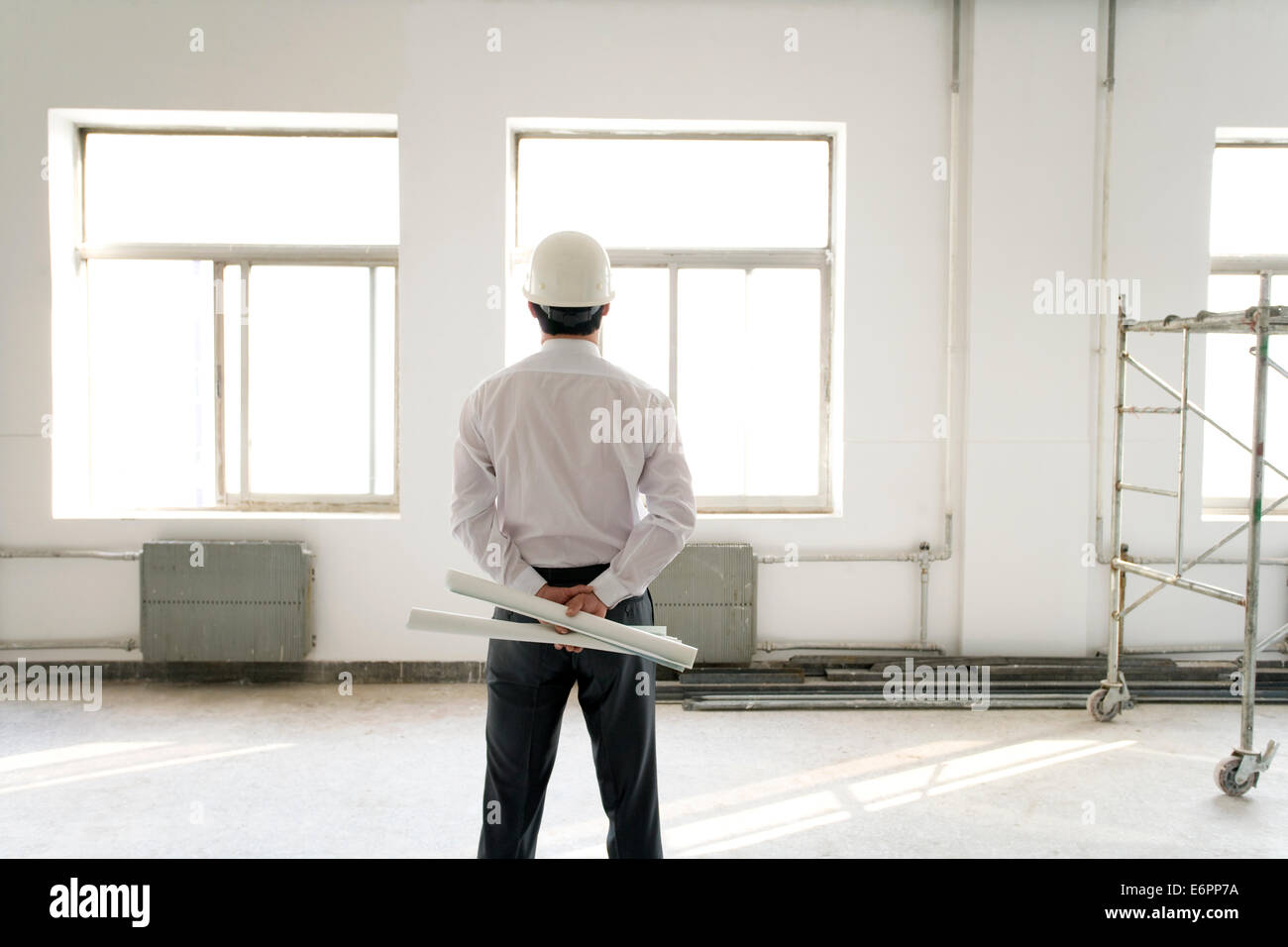 Contractor thinking at construction site Stock Photo - Alamy