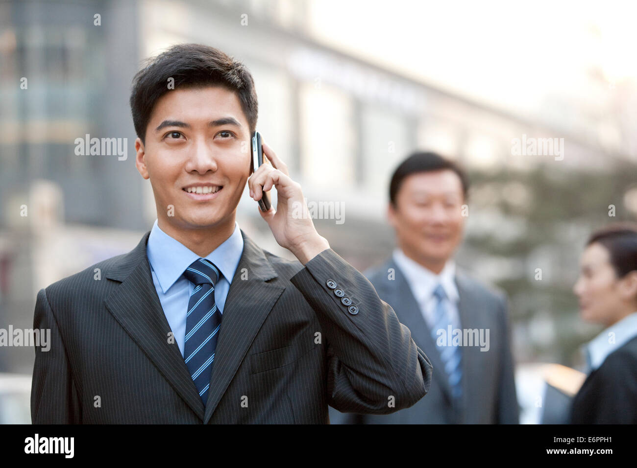 Portrait of a happy young businessman Stock Photo - Alamy