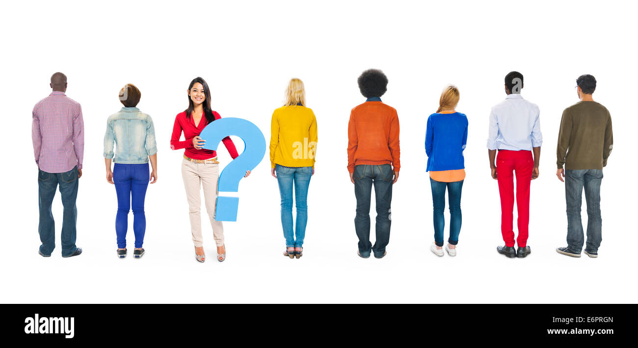 People Facing Backwards with Woman Holding Question Mark Stock Photo ...