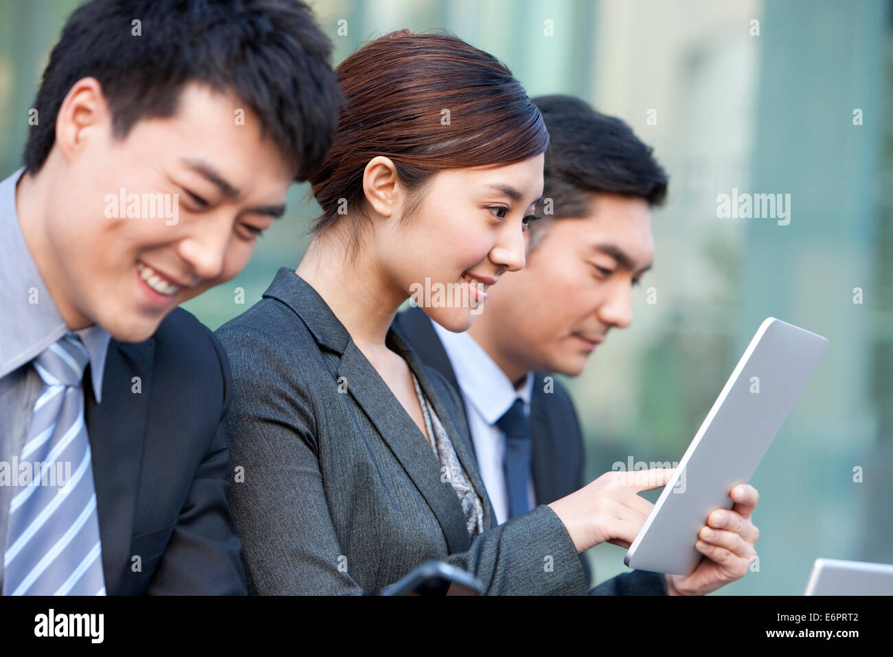 Business people using wireless technology Stock Photo - Alamy