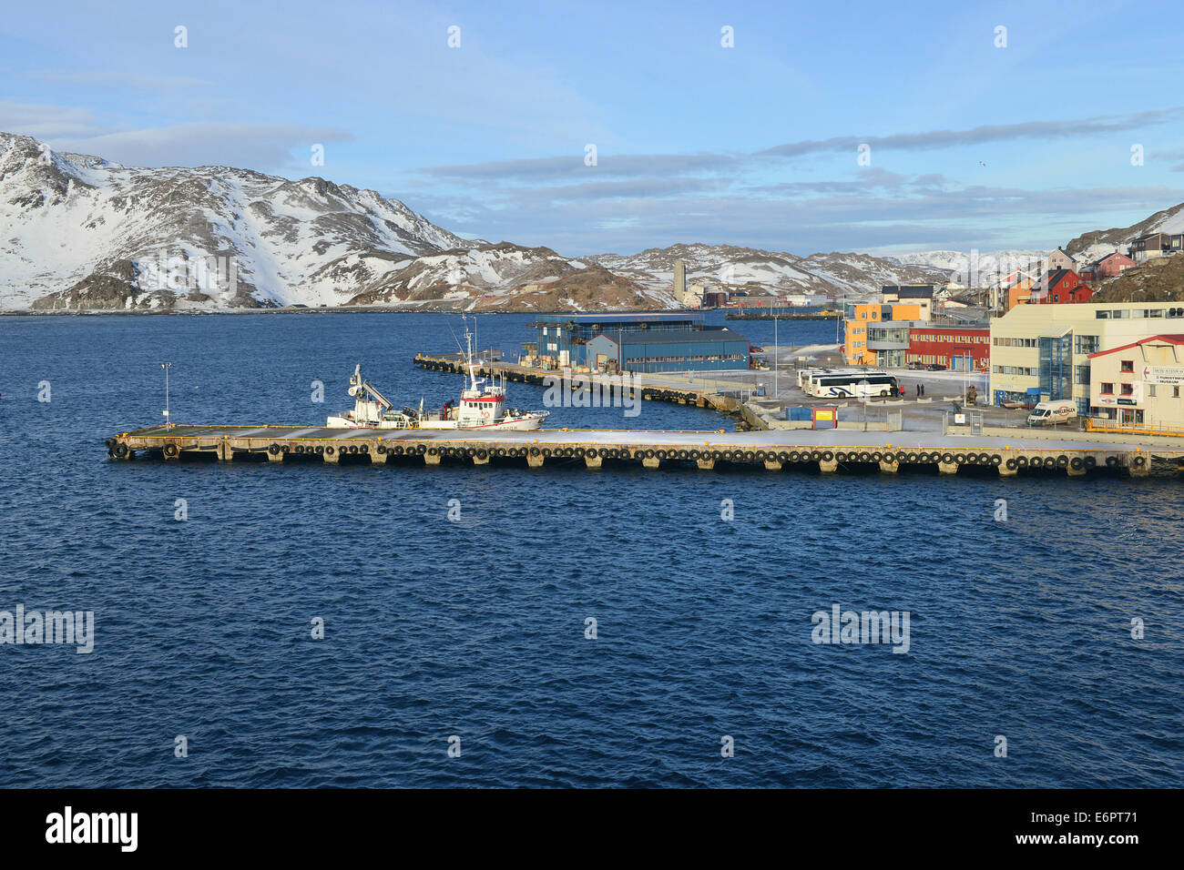 Pier with boat in bay, Honningsvåg, Magerøya island, Finnmark County ...