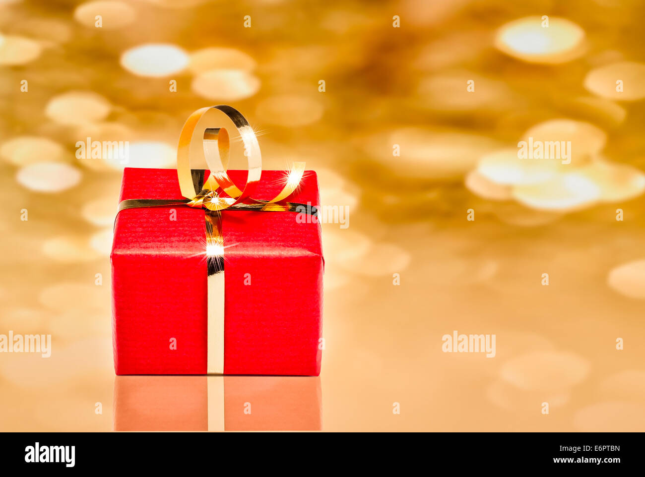 Gift Box with Golden Background Stock Photo - Alamy