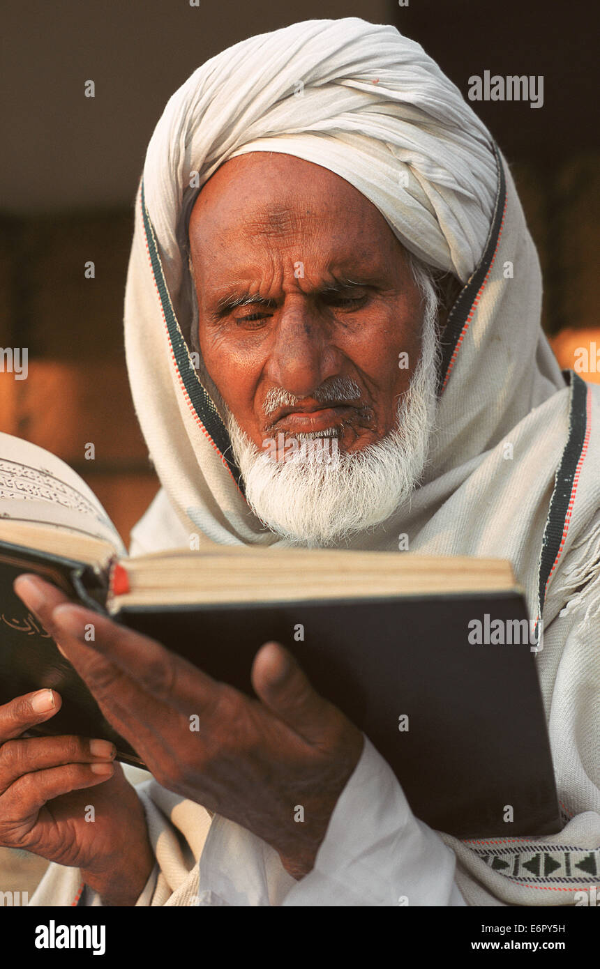 Muslim man reading hi-res stock photography and images - Alamy
