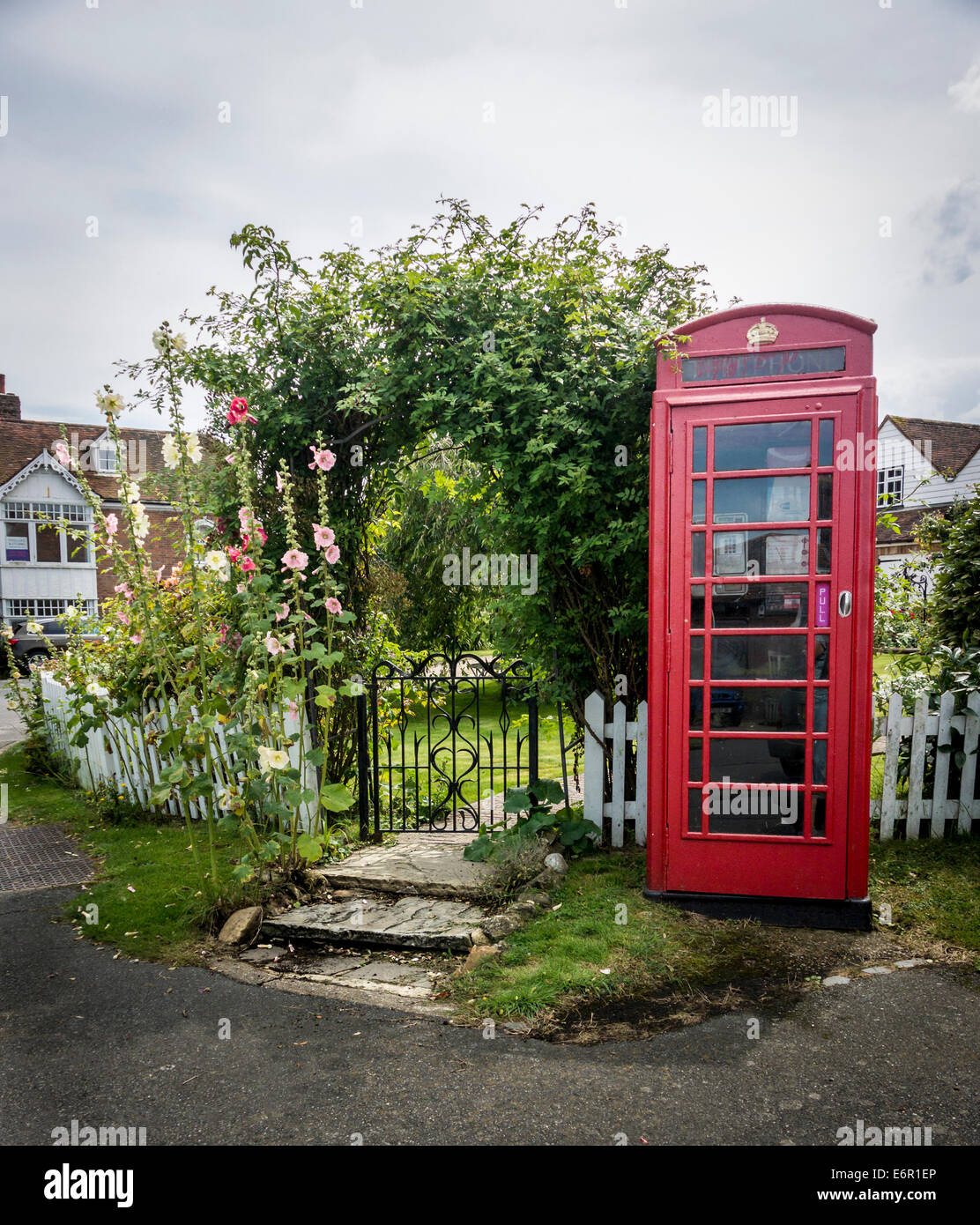 Red phone box in an English village Stock Photo - Alamy