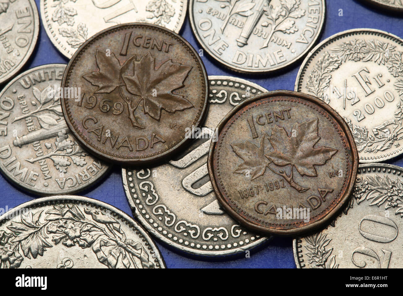 Coins of Canada. Maple leaves depicted in the Canadian one cent coins ...
