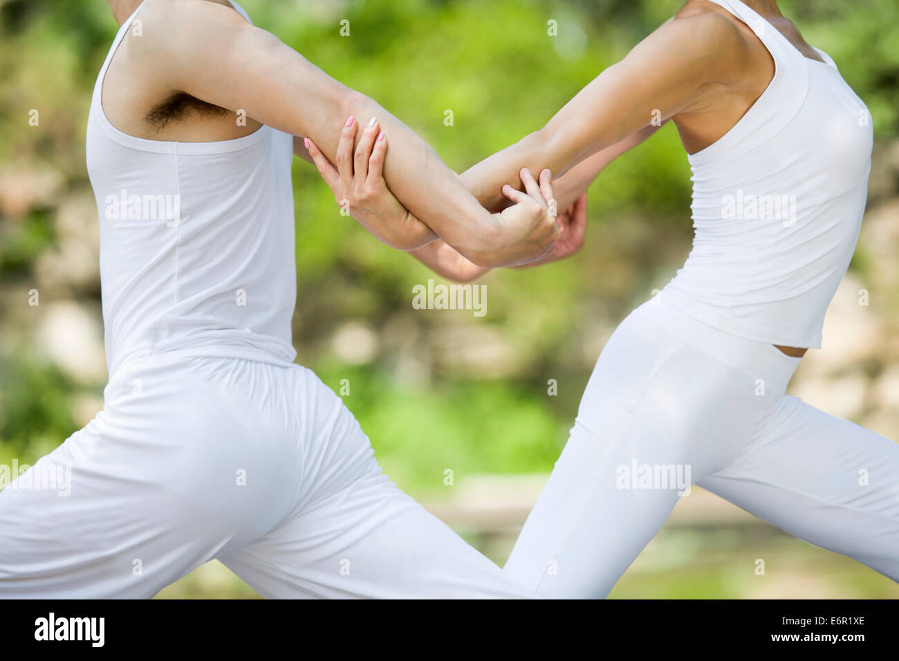 Young couple practicing yoga Stock Photo - Alamy