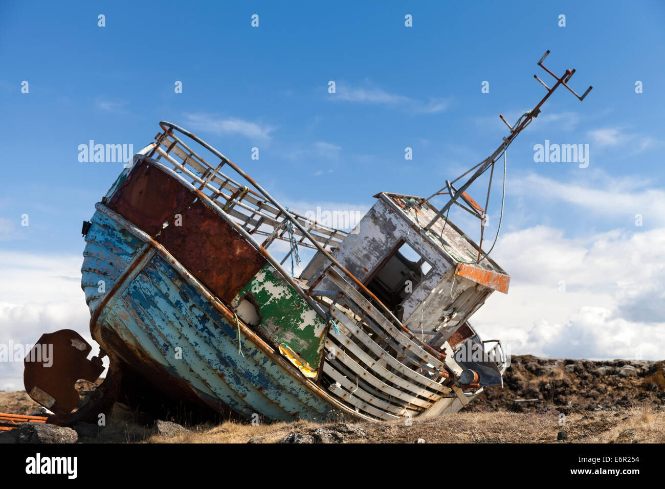 Beached and deserted old fishing boat on a clear sunny day in South ...