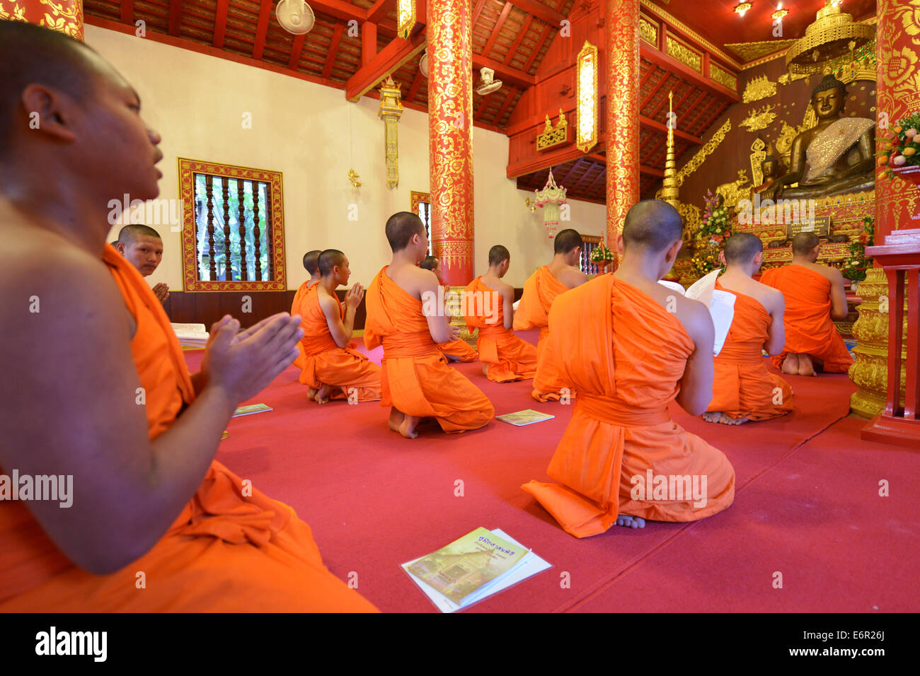 Buddhist monks praying in temple hi-res stock photography and images ...