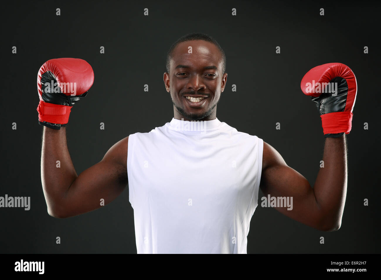 Happy African boxer raising his hands up Stock Photo - Alamy