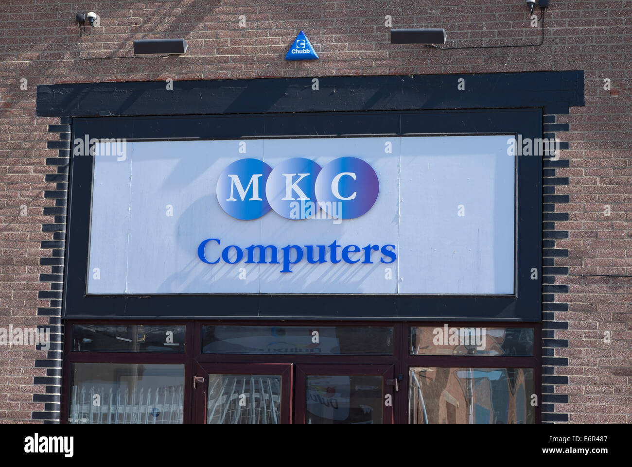 Sign over doorway for Milton Keynes computer company Milton Stock Photo ...
