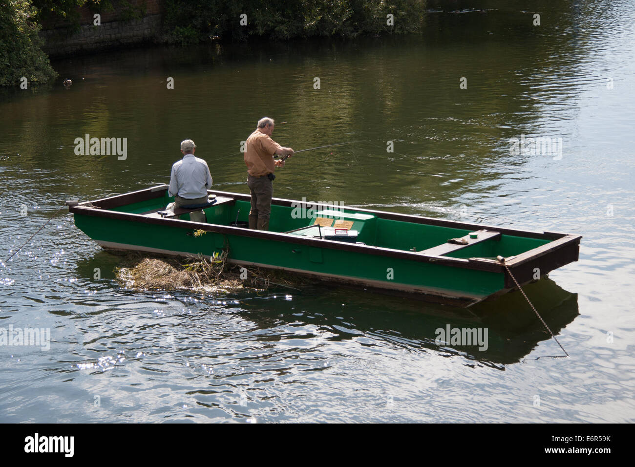 Two men fishing Stock Photo - Alamy