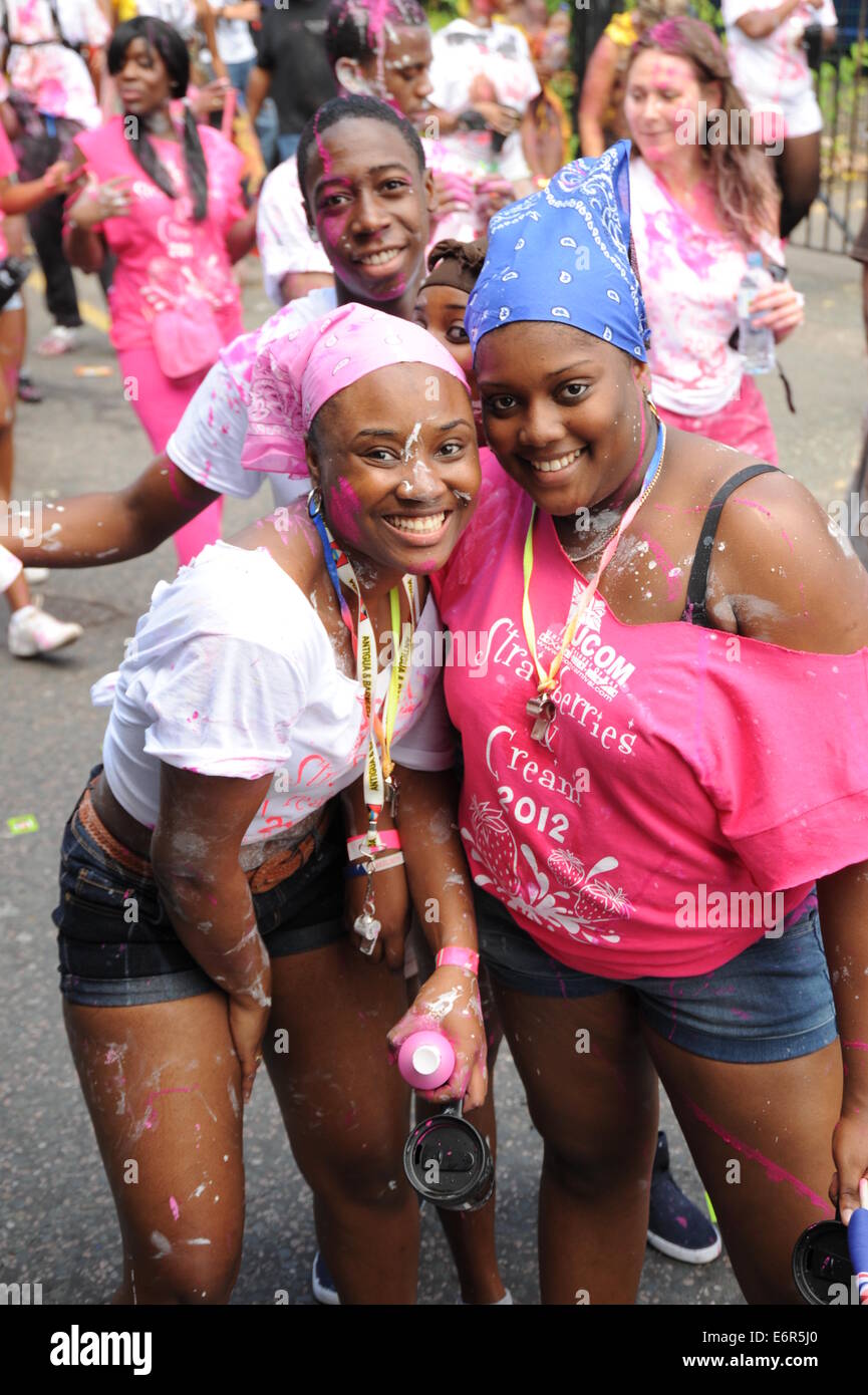 Three people at Notting Hill Carnival Stock Photo - Alamy