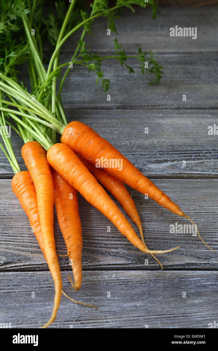 bunch juicy carrot on the board, food closeup Stock Photo - Alamy