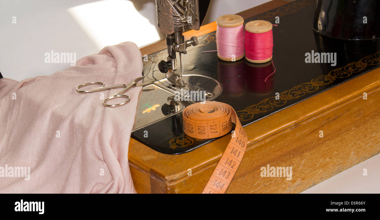 Retro Sewing machine and item of clothing material Stock Photo - Alamy