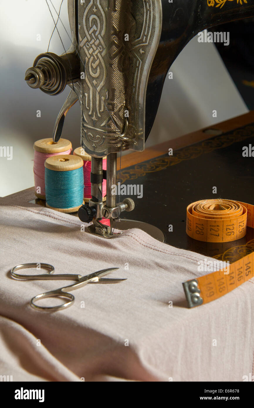 Vintage Sewing Tools and item of clothing material Stock Photo - Alamy