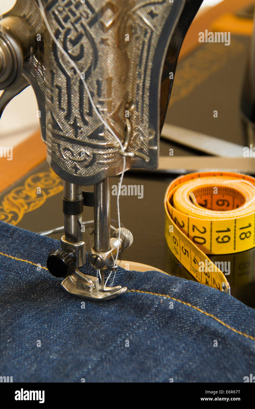 Sewing machine and item of clothing material Stock Photo - Alamy
