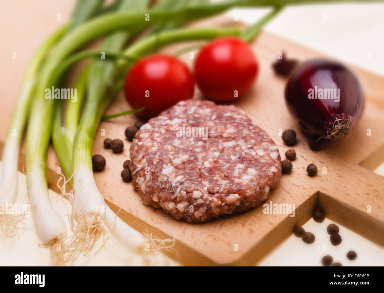 raw meatball on a chopping board and ingredients. horizontal. close-up ...