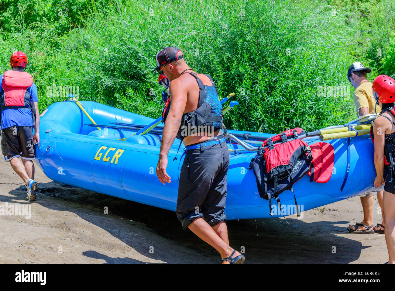 rafters carrying their inflatable raft Stock Photo - Alamy