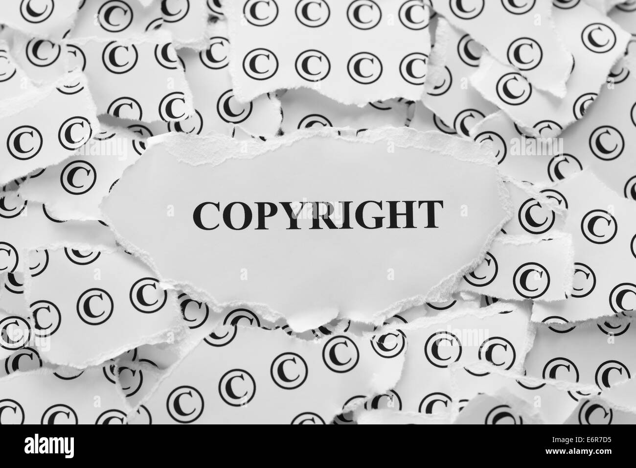 Torn pieces of paper with copyright symbols and the word "Copyright ...