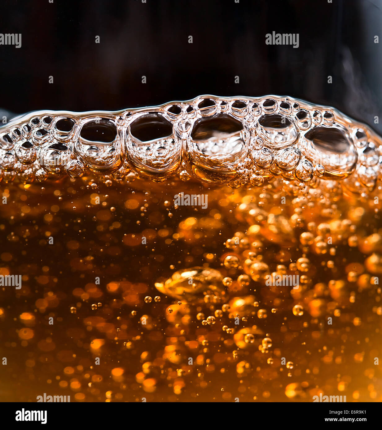 detail of an alcoholic beverage on black background Stock Photo - Alamy