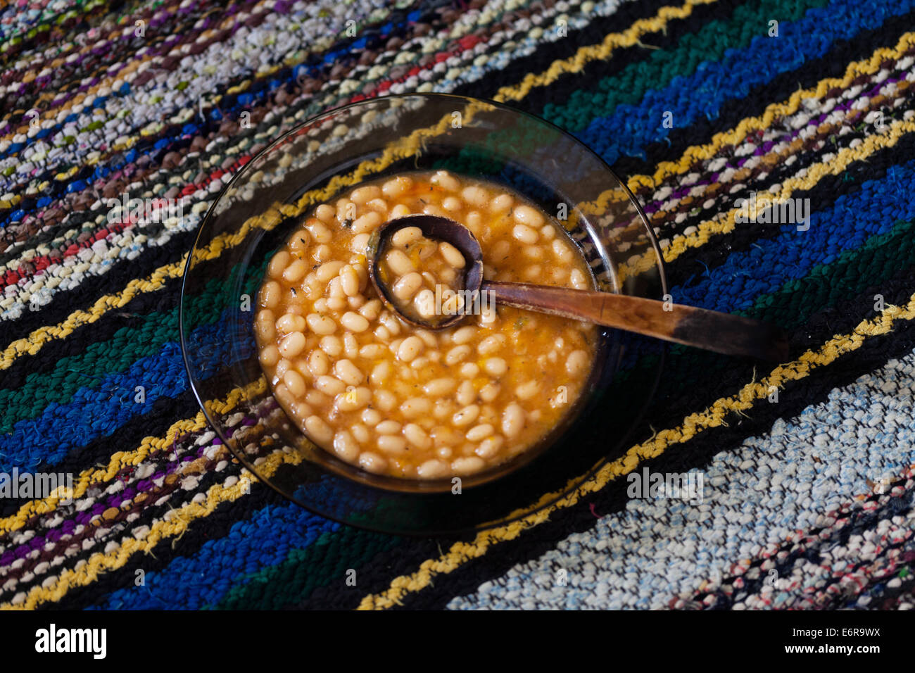 Garlic, bread, beans on a colorful rug Bulgarian, selective focus Stock ...