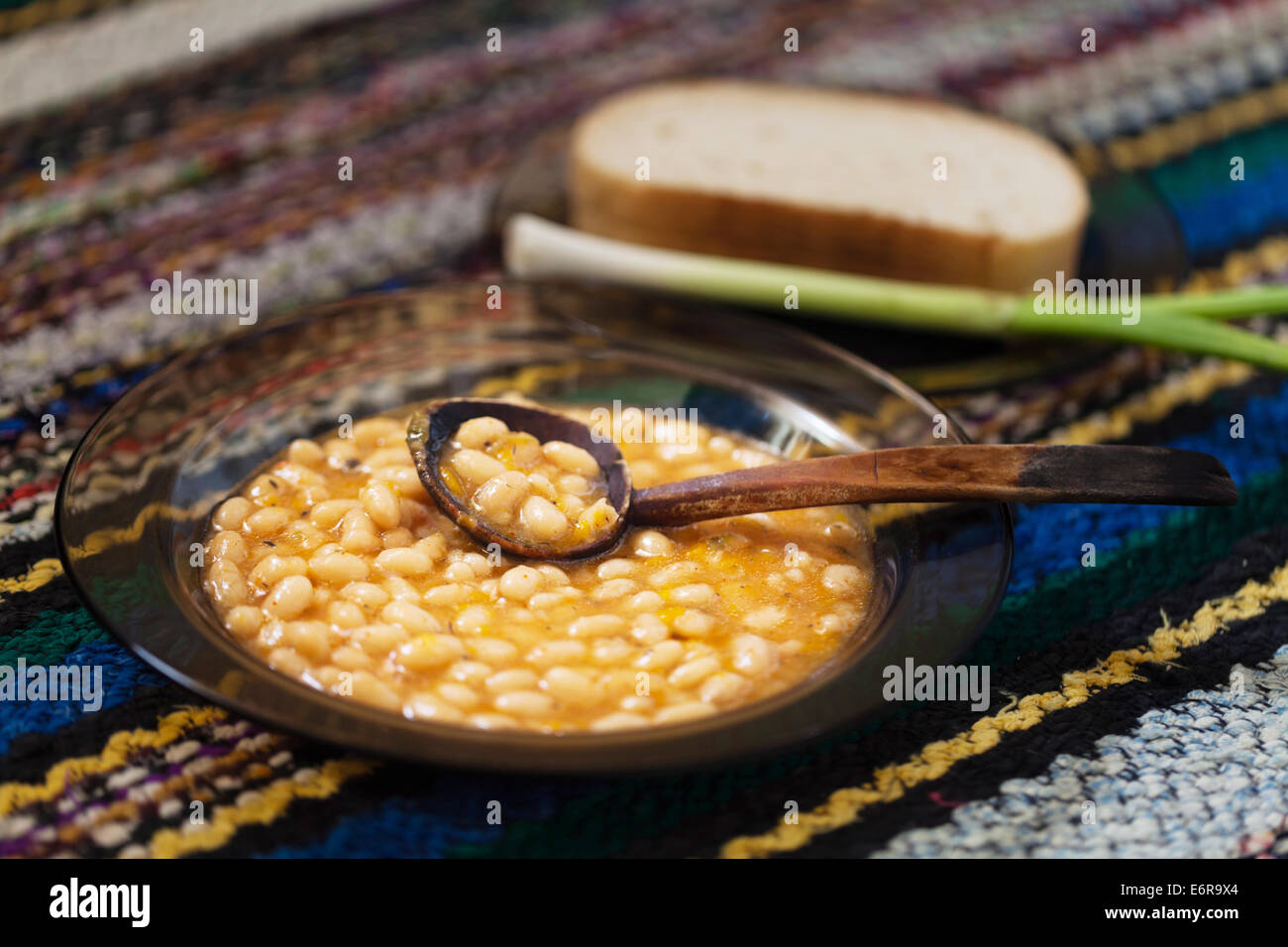 Garlic, bread, beans on a colorful rug Bulgarian, selective focus Stock ...