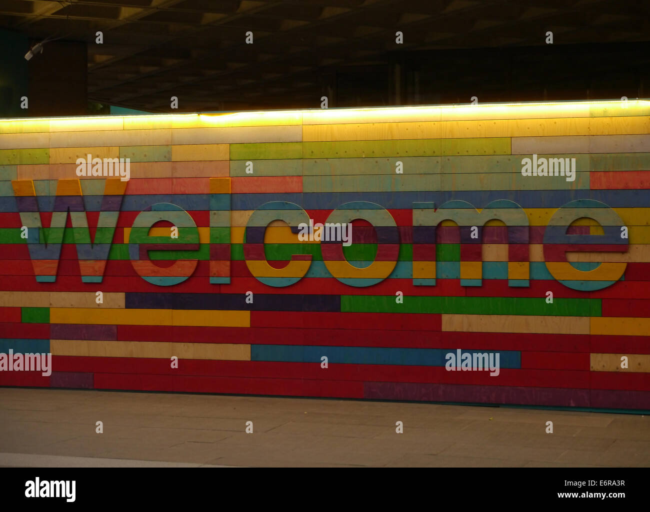 A multi coloured signage hoarding saying 'Welcome' Stock Photo - Alamy