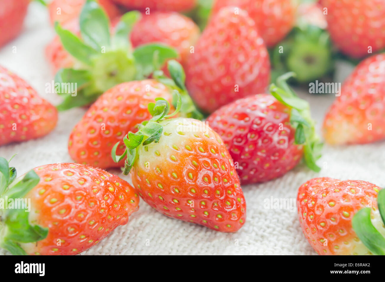 close up fresh red strawberries over sackcloth , ripe fruit Stock Photo ...