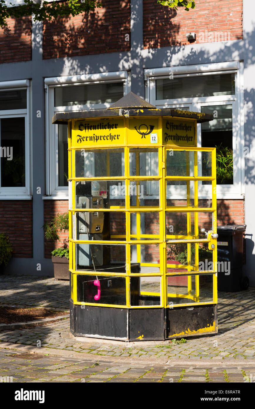 Yellow telephone box in the Schnoor quarter of Bremen, Germany Stock ...