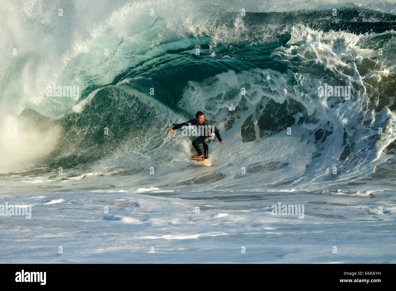 Surfers riding the huge surf created by Hurricane Marie in the Pacific ...