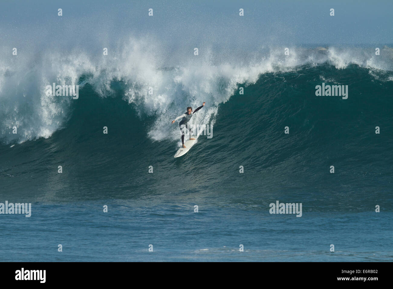 Surfers riding the huge surf created by Hurricane Marie in the Pacific ...