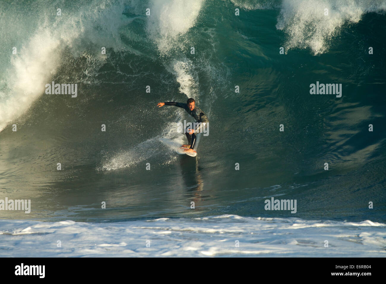 Surfers riding the huge surf created by Hurricane Marie in the Pacific ...