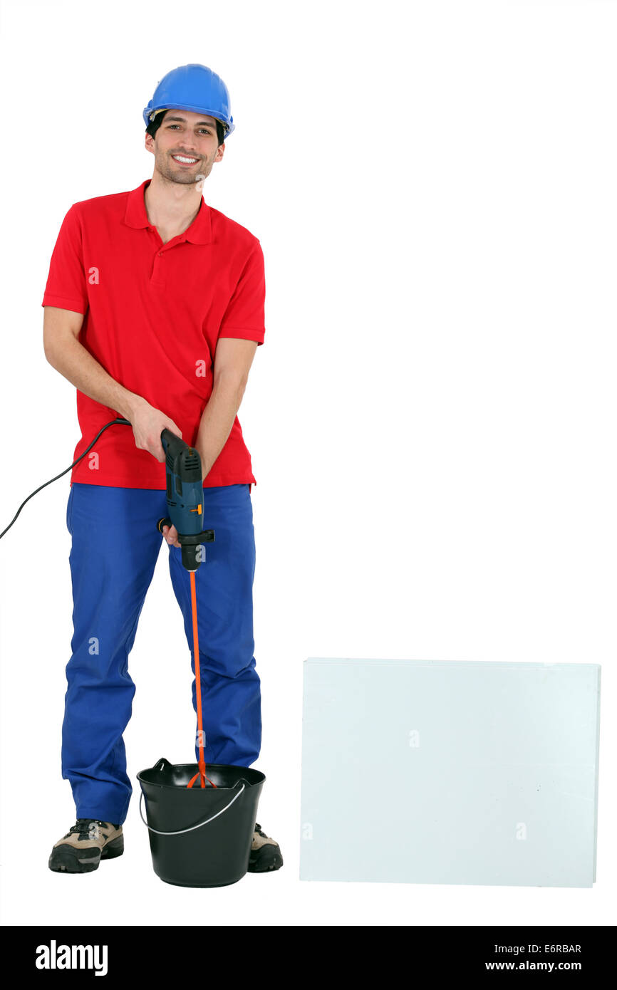 Tradesman using a screw gun Stock Photo - Alamy