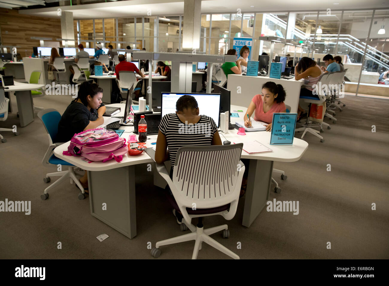community college students use large computer lab to study, do research ...