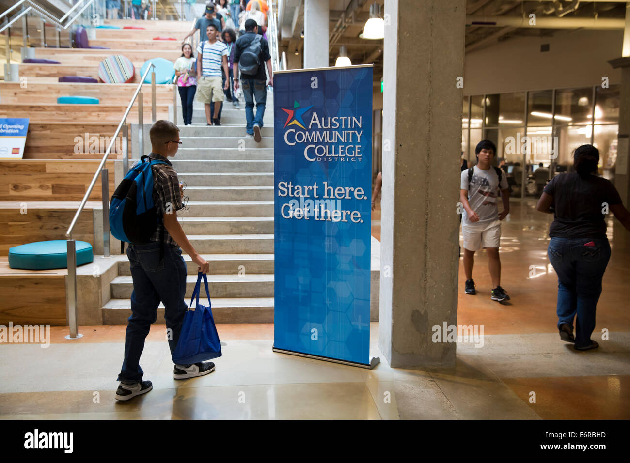 students of all ages and teachers walk up and down stairs during change ...