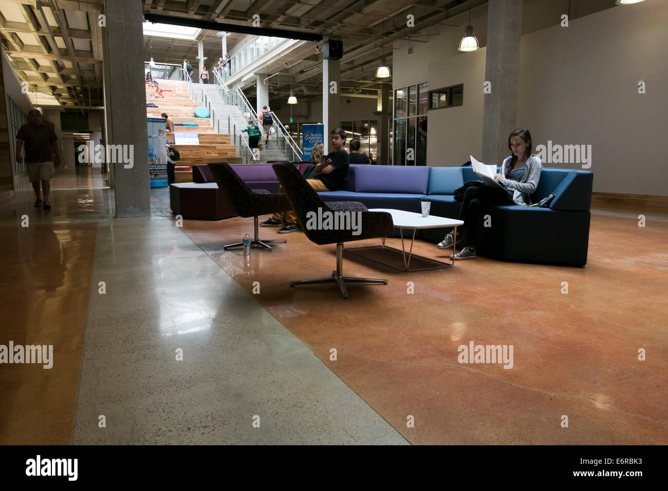 Students relaxing, walking in hallways of new campus of Austin ...