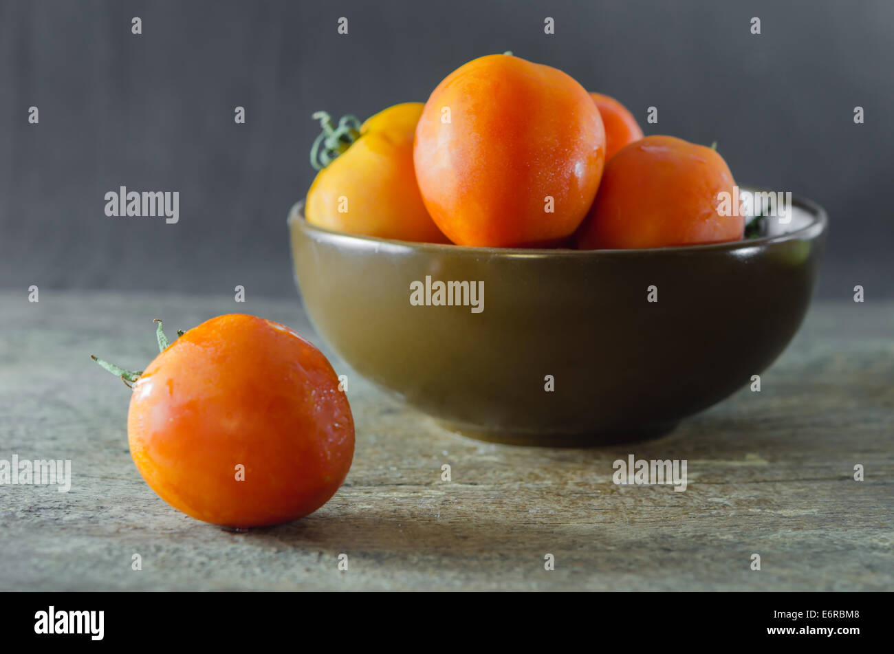 red ripe vegetable , tomato over wooden table Stock Photo - Alamy