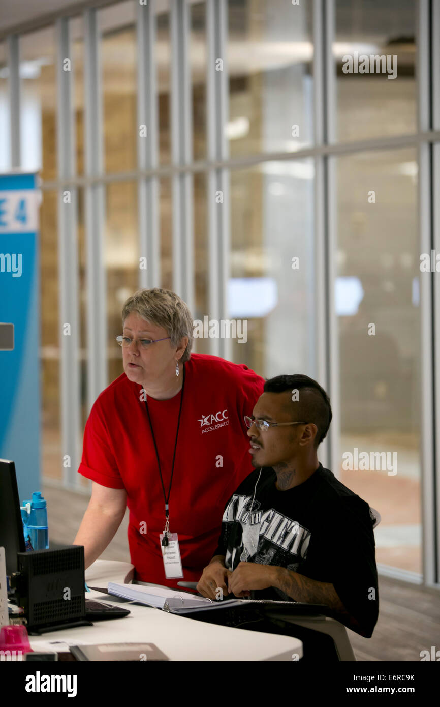 Female teacher tutors a male student inside the computer and tutoring ...