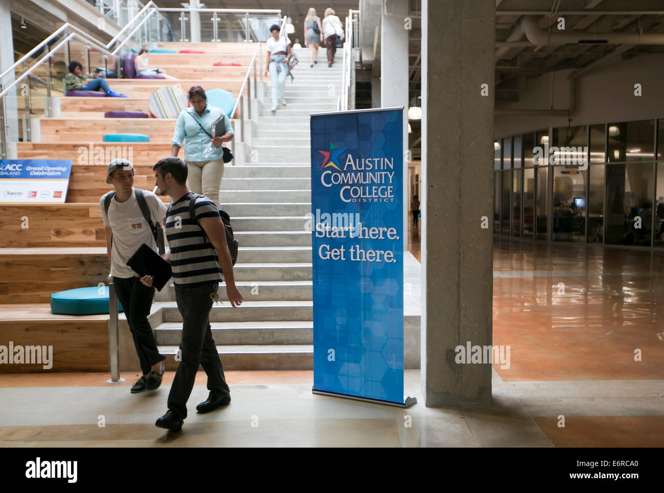 students of all ages and teachers walk up and down stairs during change ...