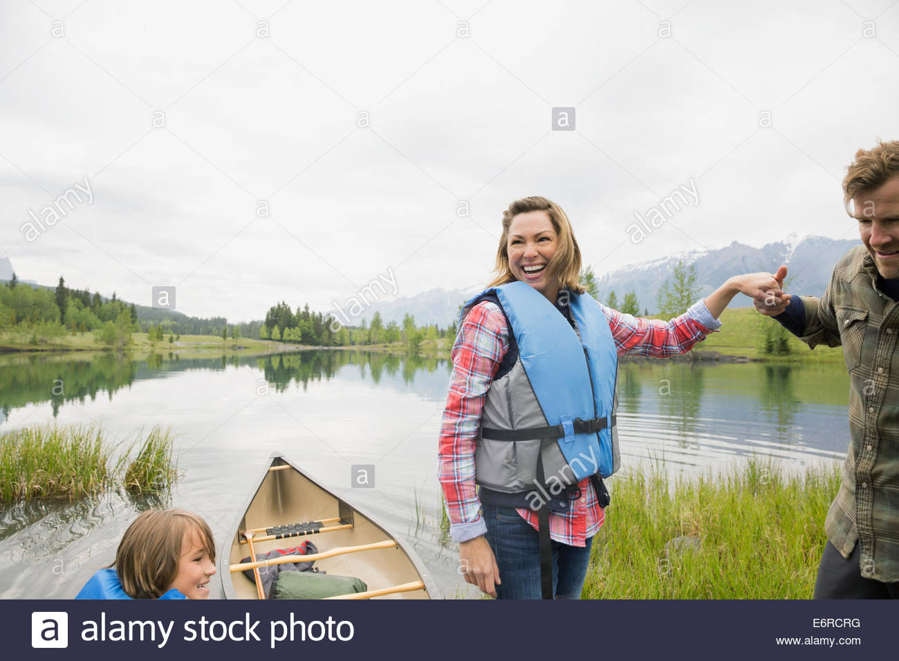 Helping people to safety in boat hi-res stock photography and images ...