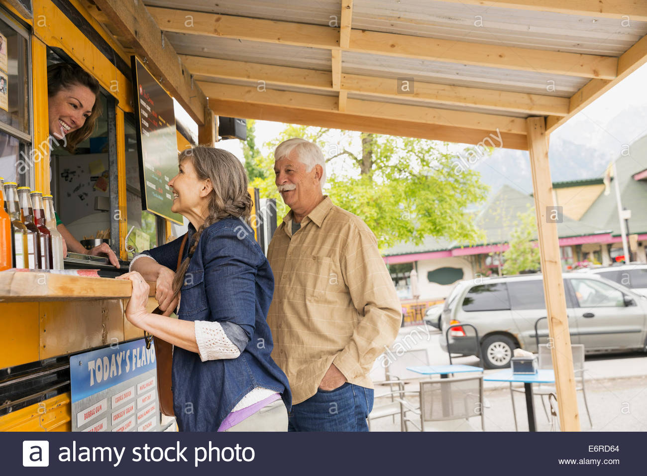 Older couple ordering at food truck Stock Photo - Alamy