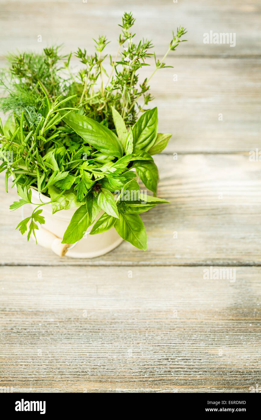 Fresh herbs outdoor on the wooden table Stock Photo - Alamy