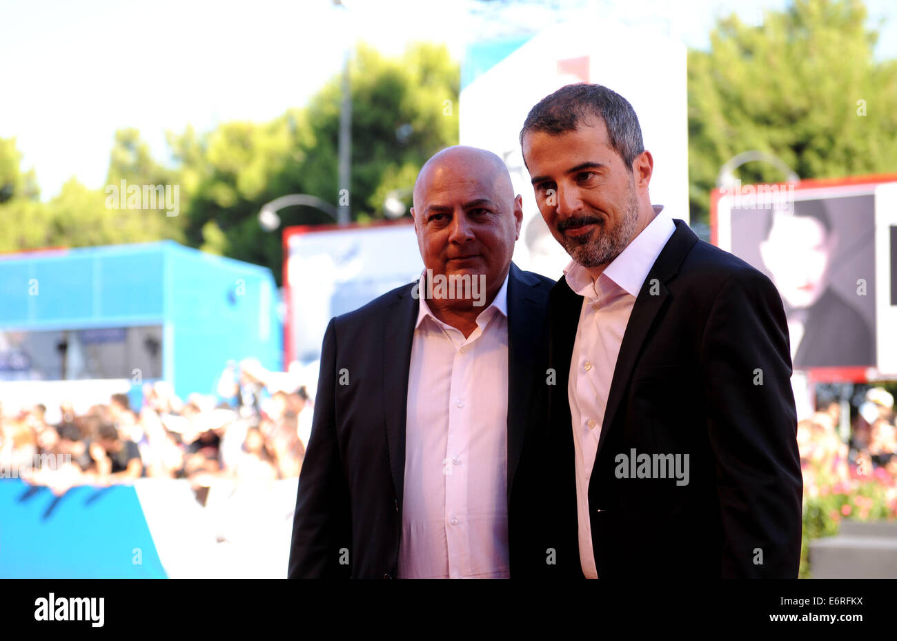 Venice. 29th Aug, 2014. Director Francesco Munzi (R) poses on the red ...