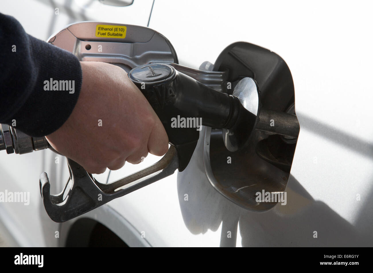 Person filling gas at station Stock Photo - Alamy