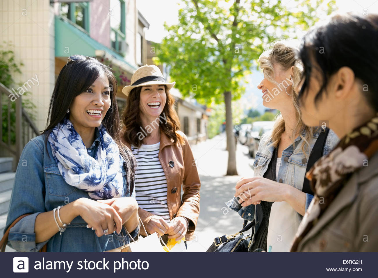 Women talking standing outdoors hi-res stock photography and images - Alamy